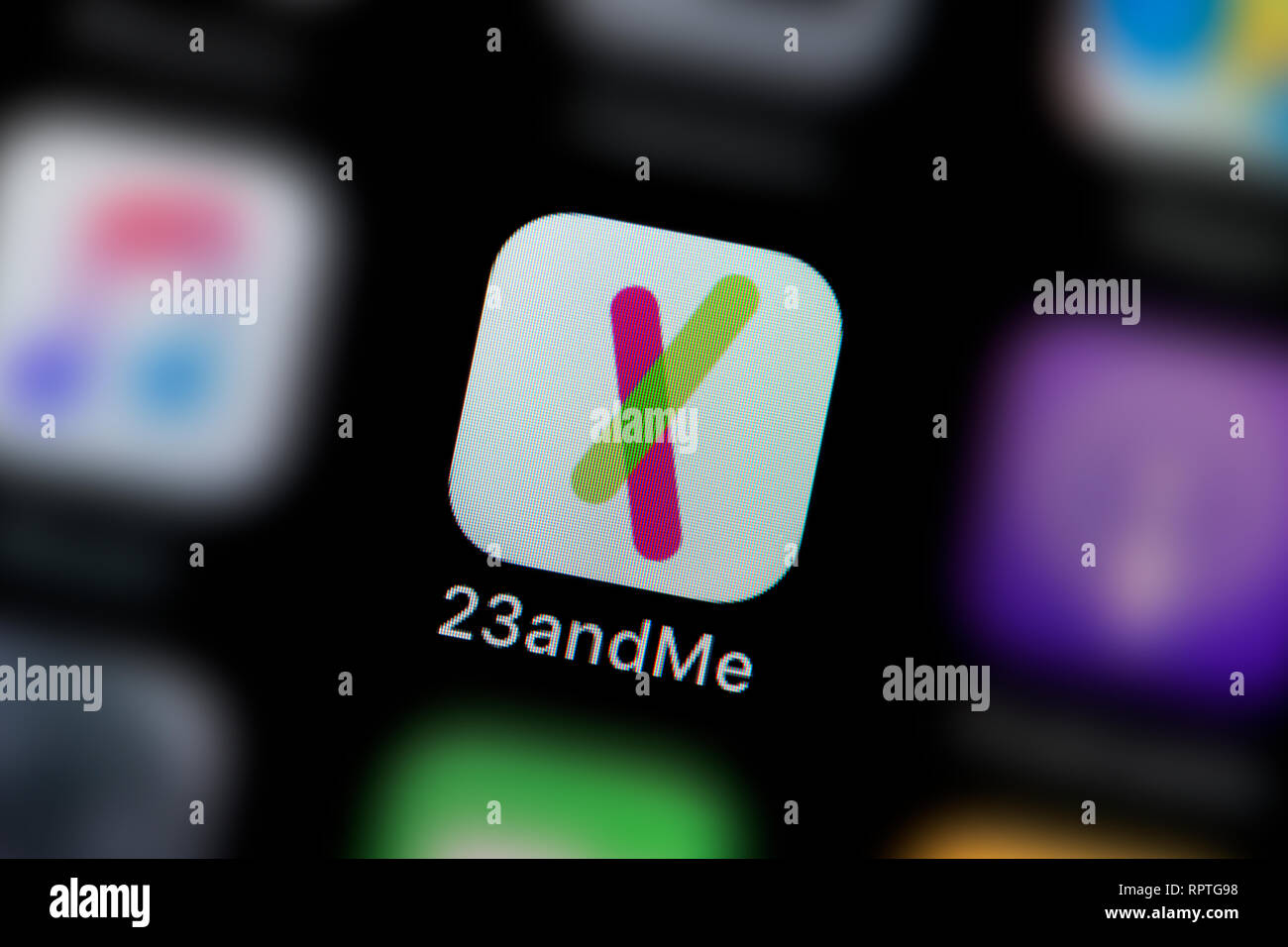 A close-up shot of the 23andMe app icon, as seen on the screen of a ...