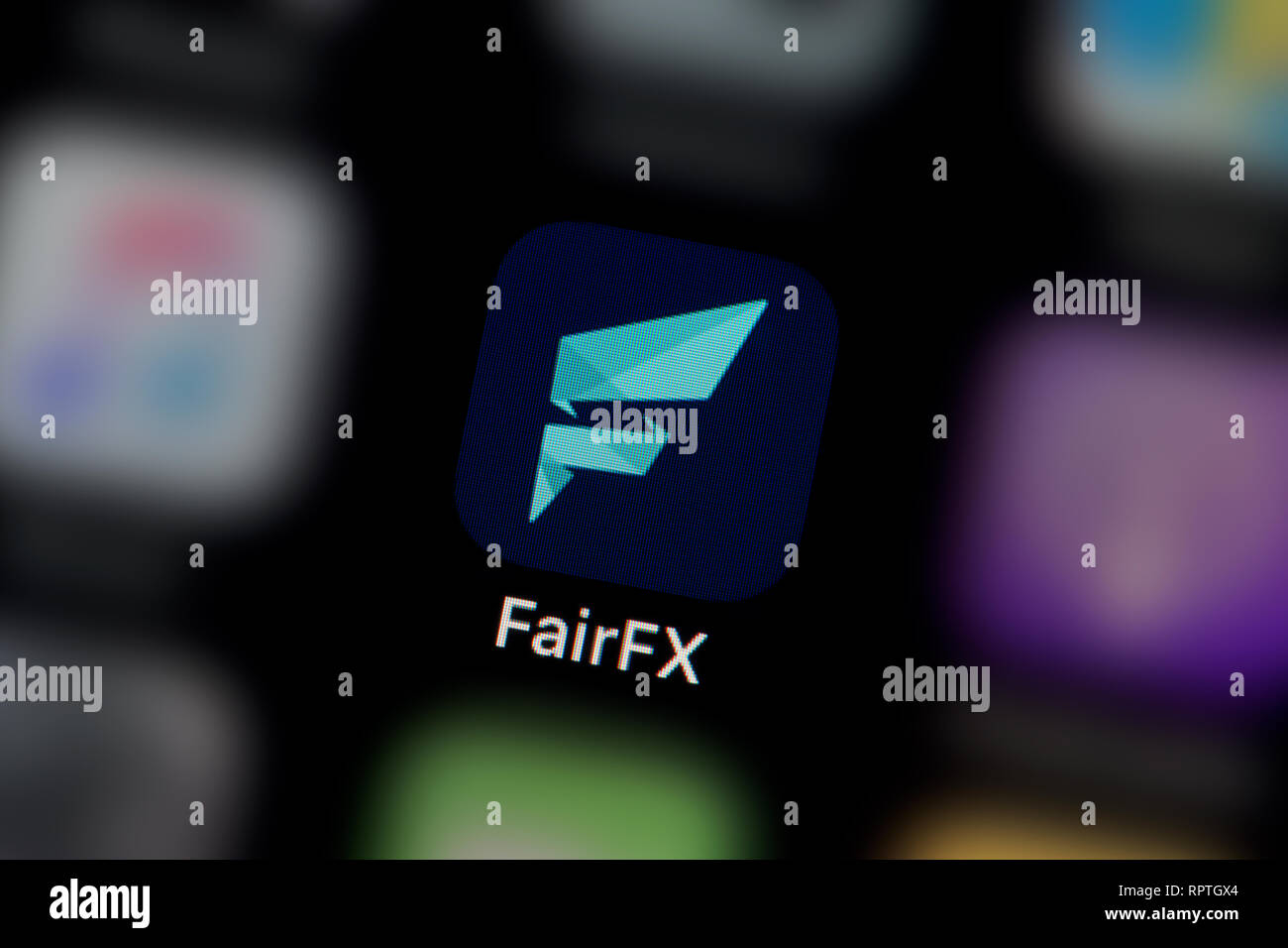 A close-up shot of the FairFX app icon, as seen on the screen of a ...