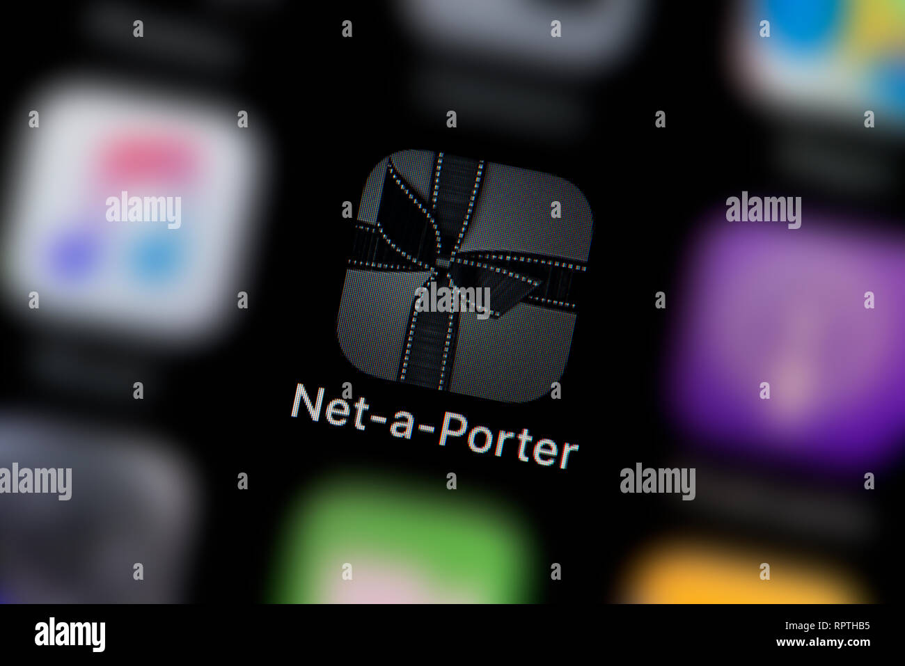 A close-up shot of the Net-a-porter app icon, as seen on the screen of ...