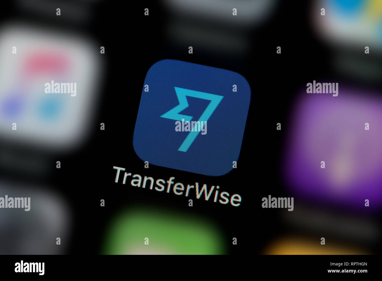 A close-up shot of the TransferWise app icon, as seen on the screen of ...