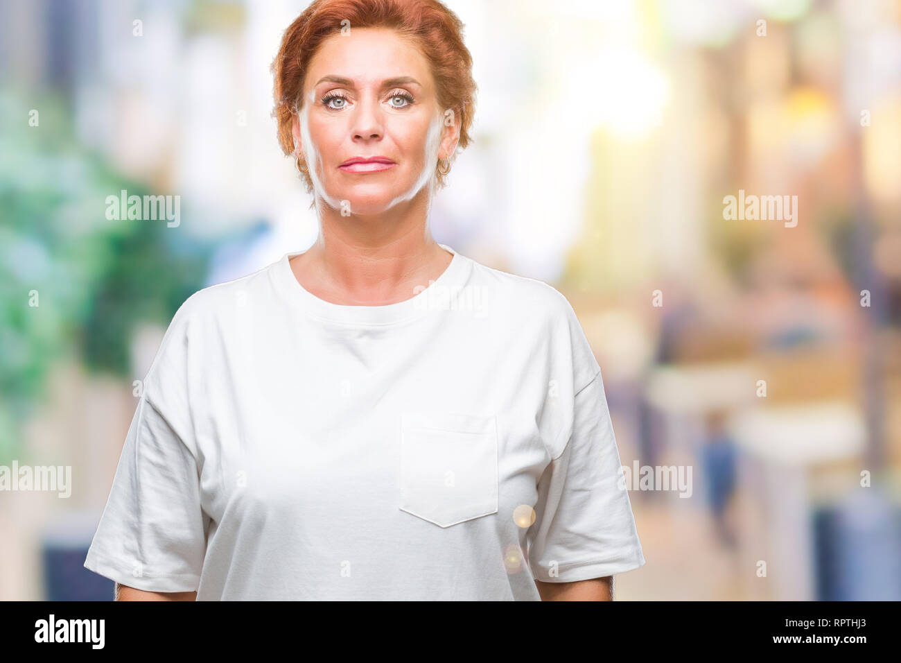 Atrractive senior caucasian redhead woman over isolated background with ...