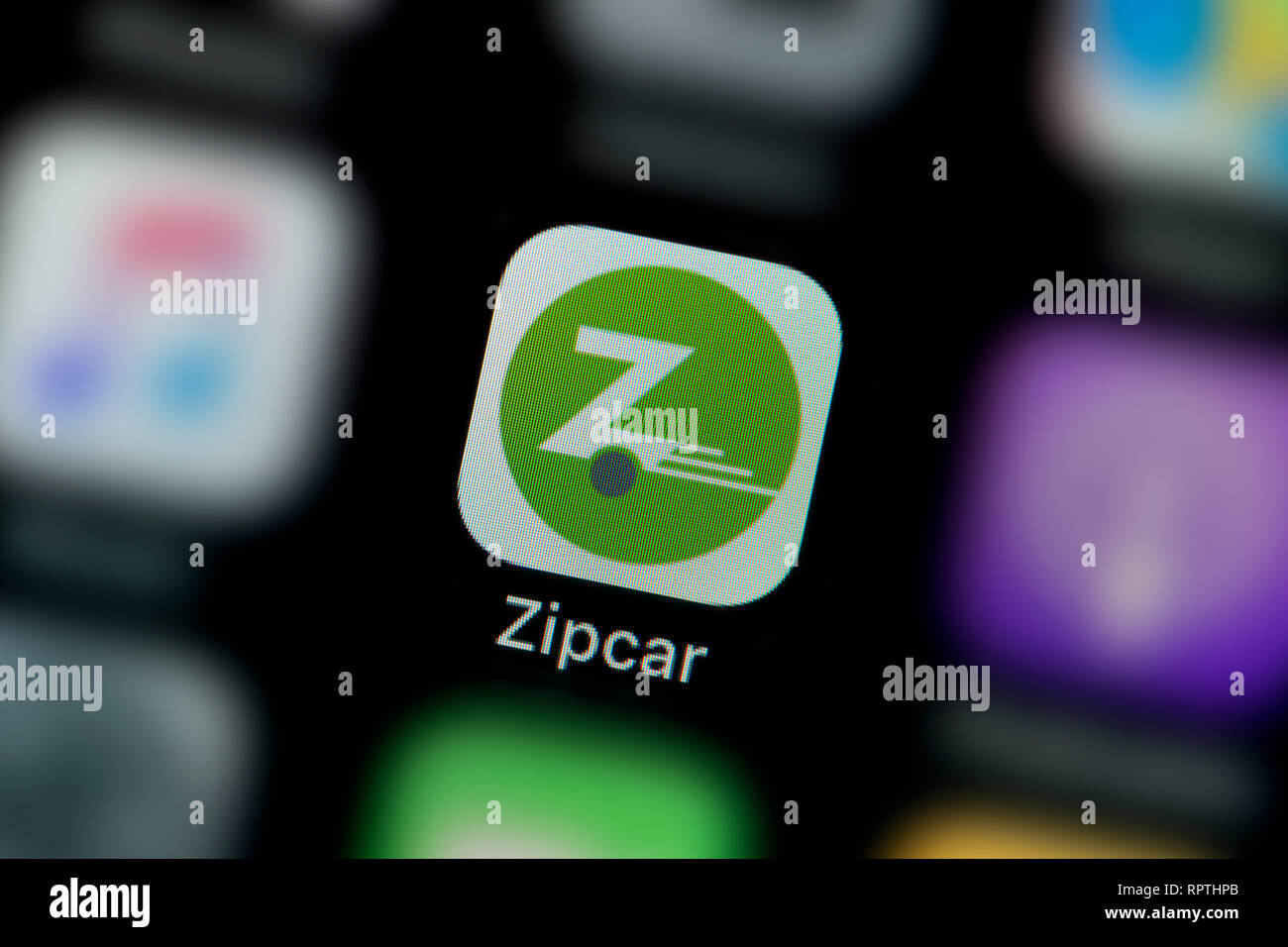 A close-up shot of the Zipcar app icon, as seen on the screen of a ...