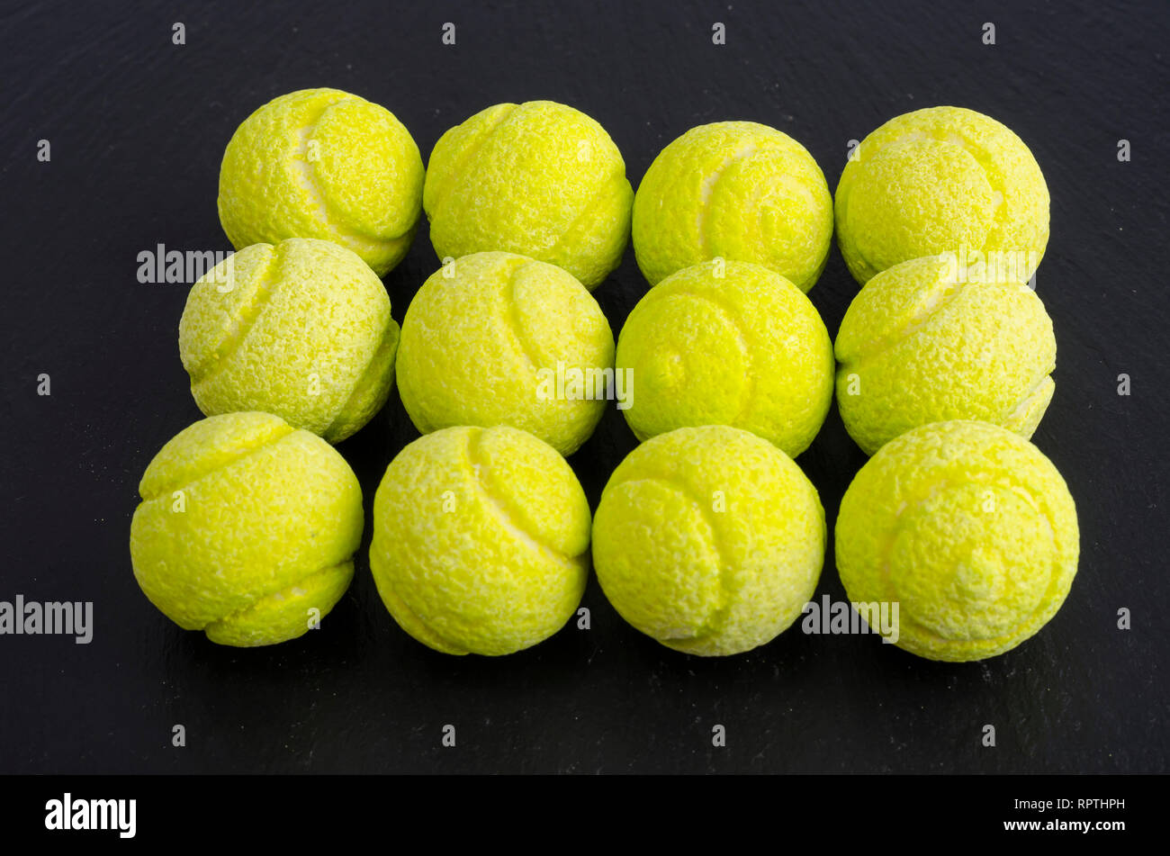 Round balls of chewing candies on black background. Studio Photo Stock ...
