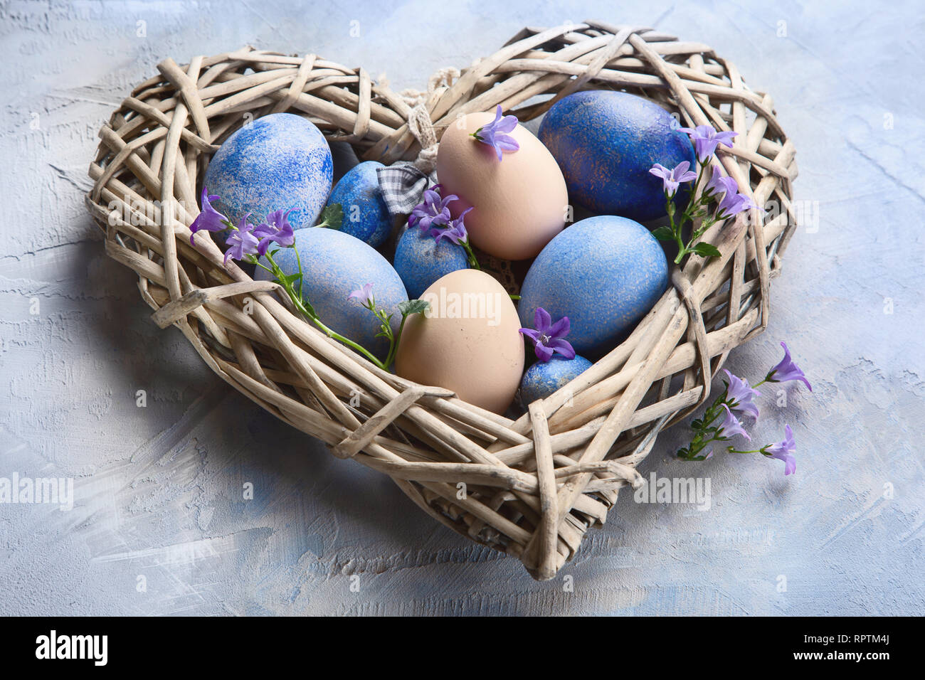 Easter eggs in heart shaped nest Stock Photo - Alamy