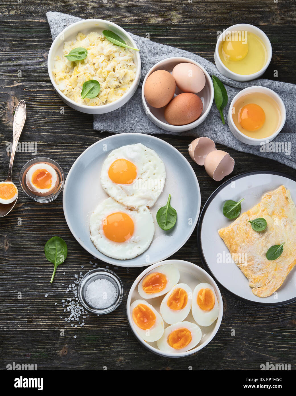 Different Ways to Cook Eggs on dark wooden background. Top view Stock ...