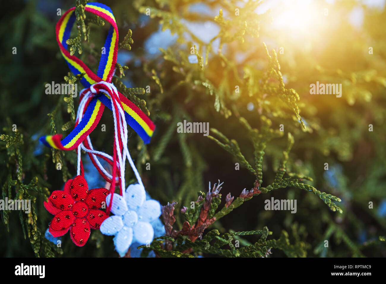 Beautiful Martisor with Romanian tricolor elements on red holiday ...