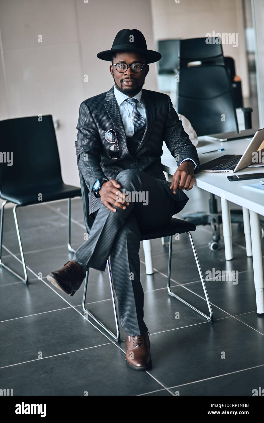 dandy afro guy posing to the camera. people, formal clothes. beauty ...