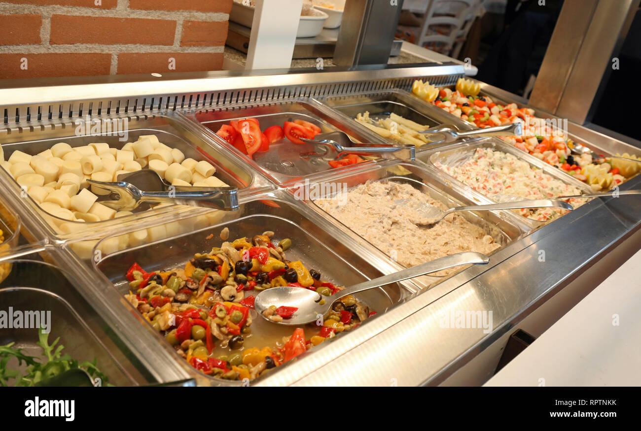 Inside a self service restaurant with many raw and cooked foods Stock ...
