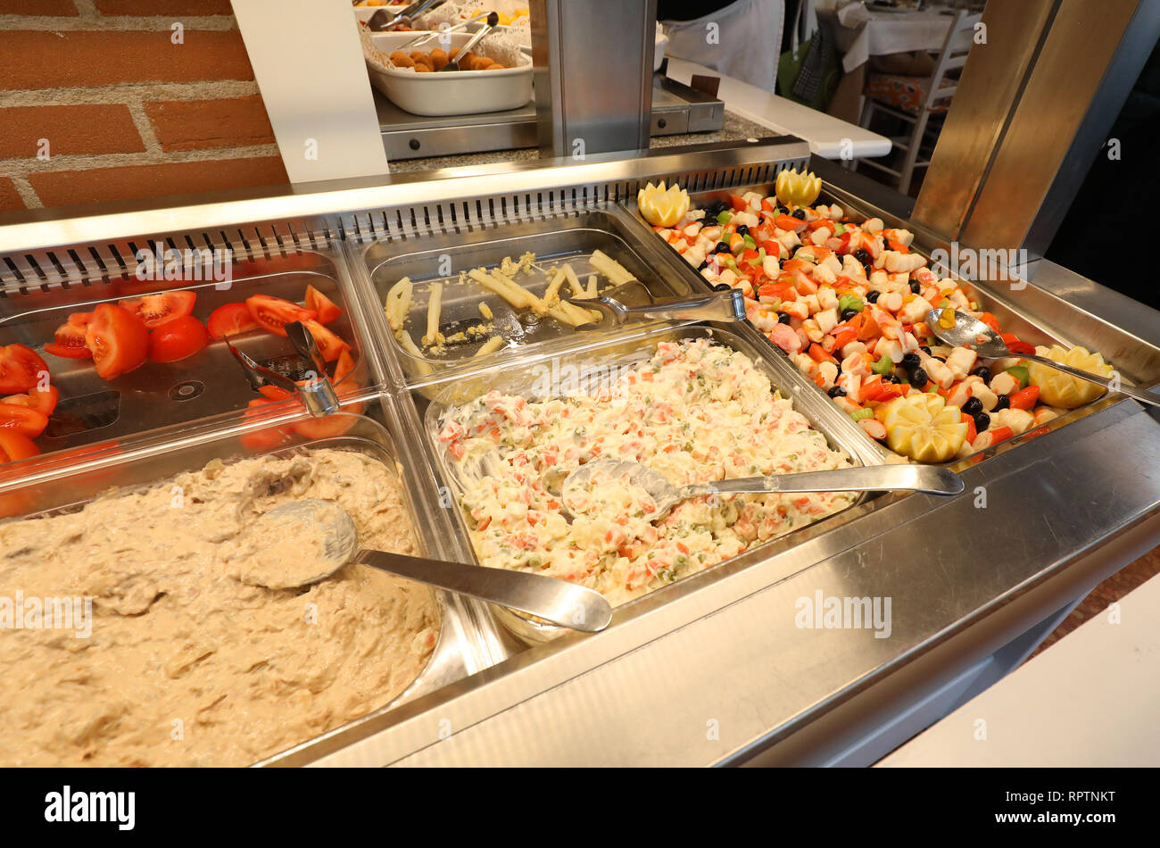 Inside a self service restaurant with many raw and cooked foods Stock ...