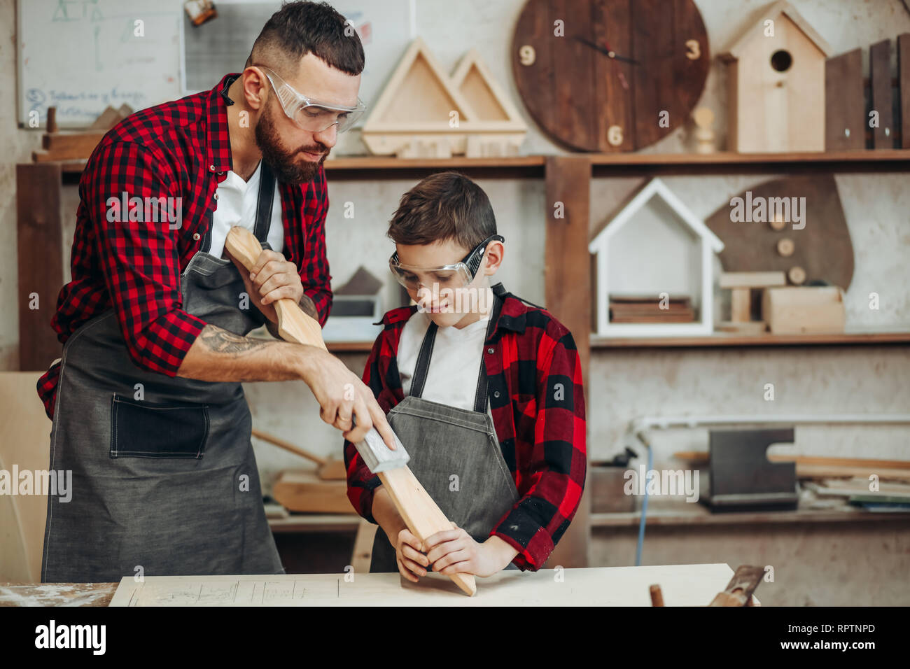 Family relations, fatherhood, hobby, carpentry, woodwork concept ...