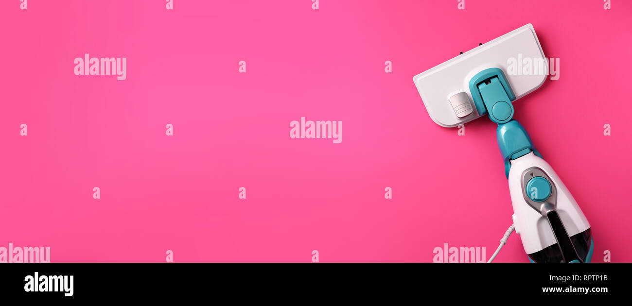 Steam cleaner mop on pink background. Top view, flat lay. Banner with ...