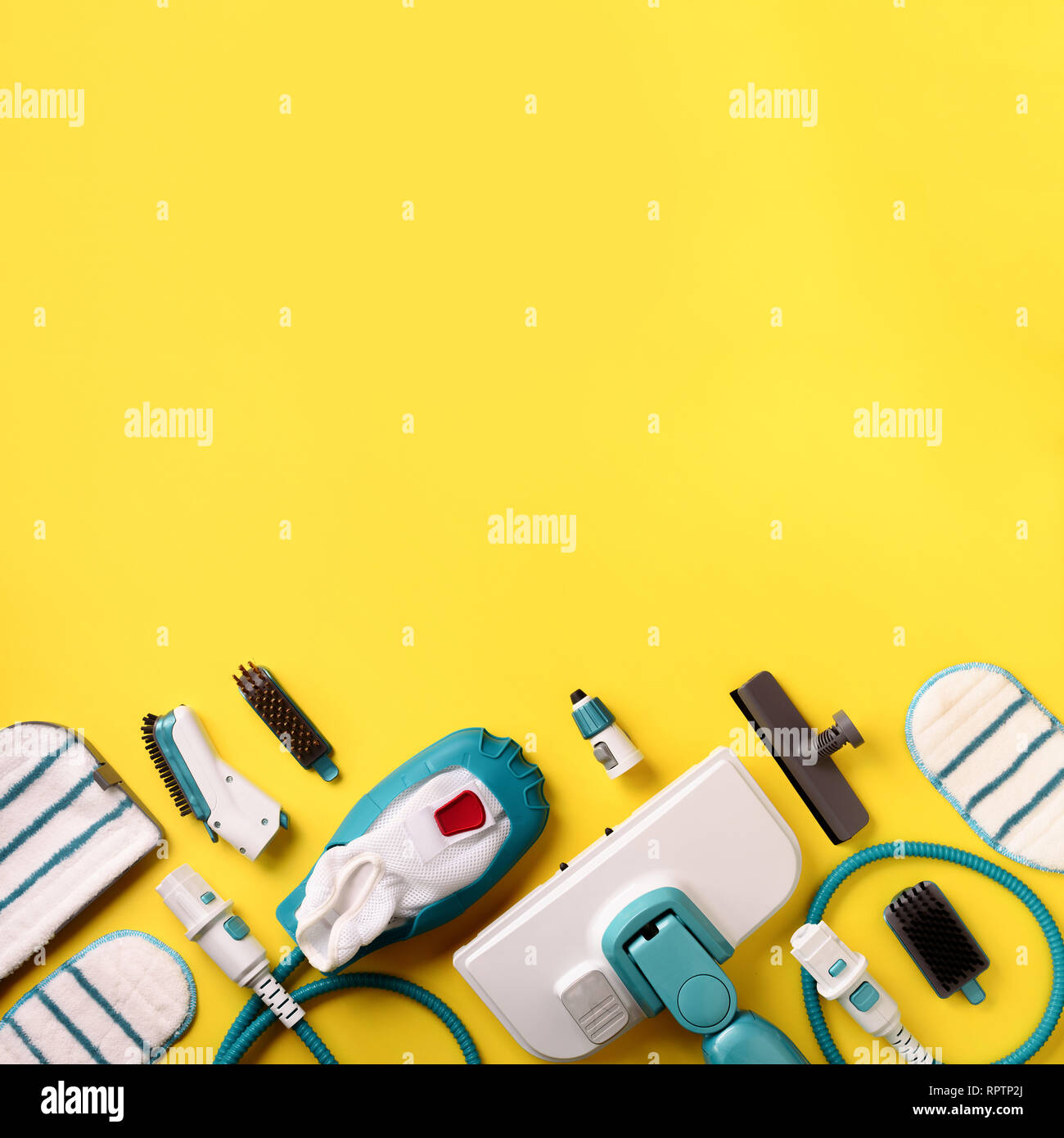 Set with modern professional steam cleaners on yellow background. Top ...