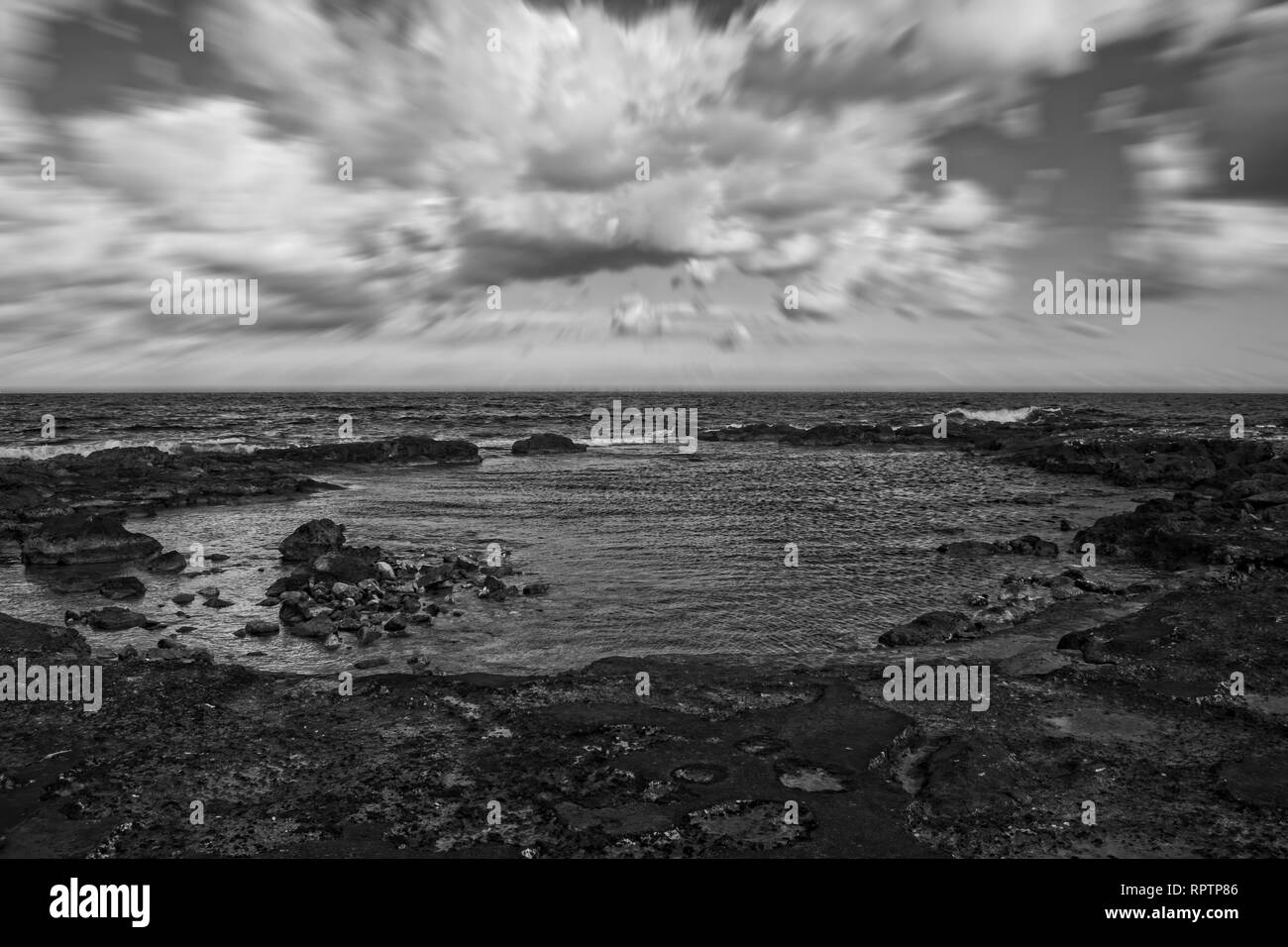 Incoming Storm over the Sea. A rocky shore in Malta featuring the ...