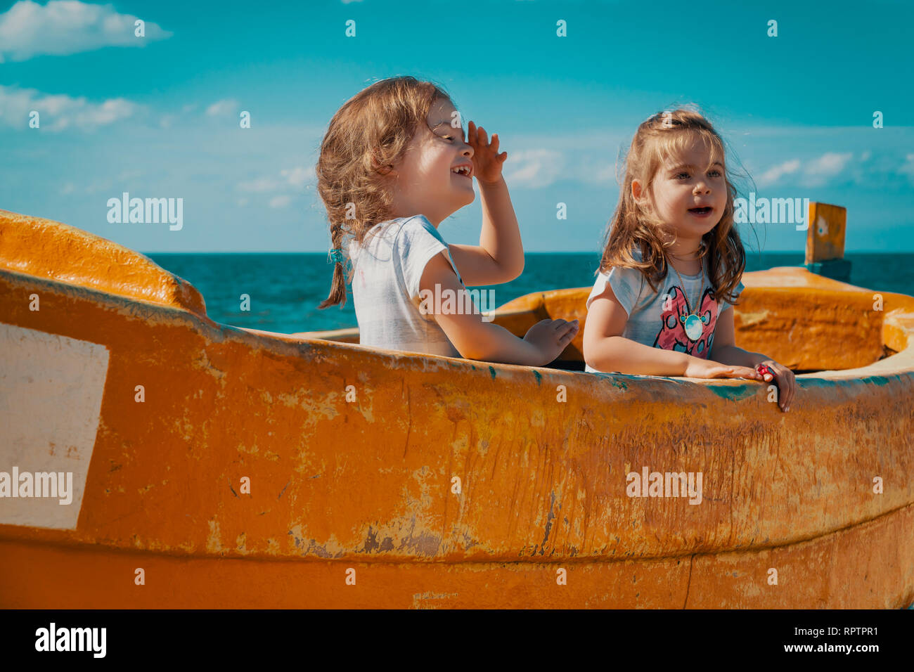 Two girls fishing on boat hi-res stock photography and images - Alamy
