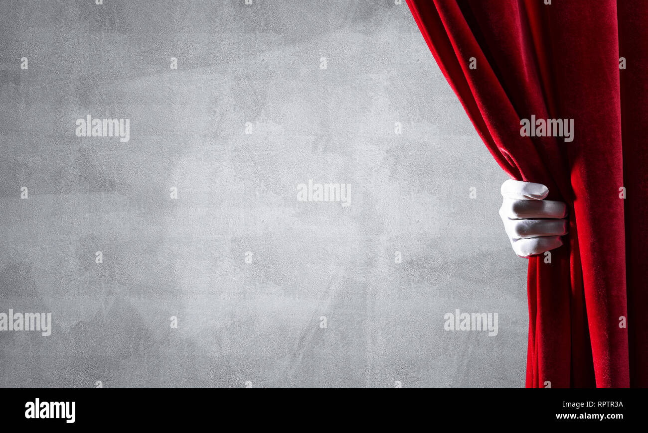 Close up of hand in white glove open red velvet curtain Stock Photo - Alamy
