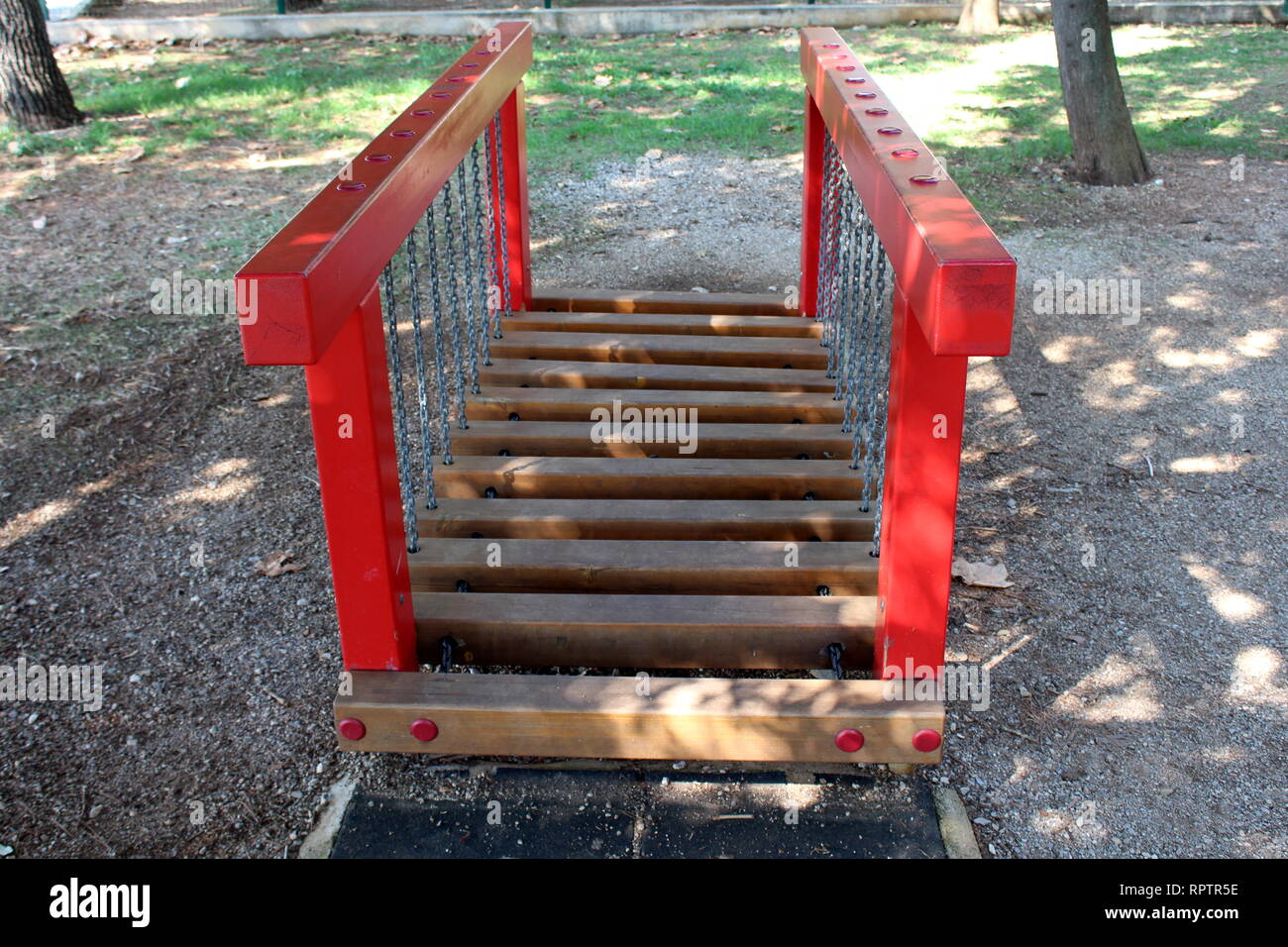 Chain suspended wooden bridge vintage retro outdoor public playground ...