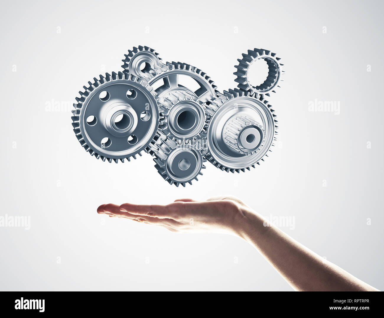 Close up of male hand holding metal gears mechanism in palm Stock Photo ...