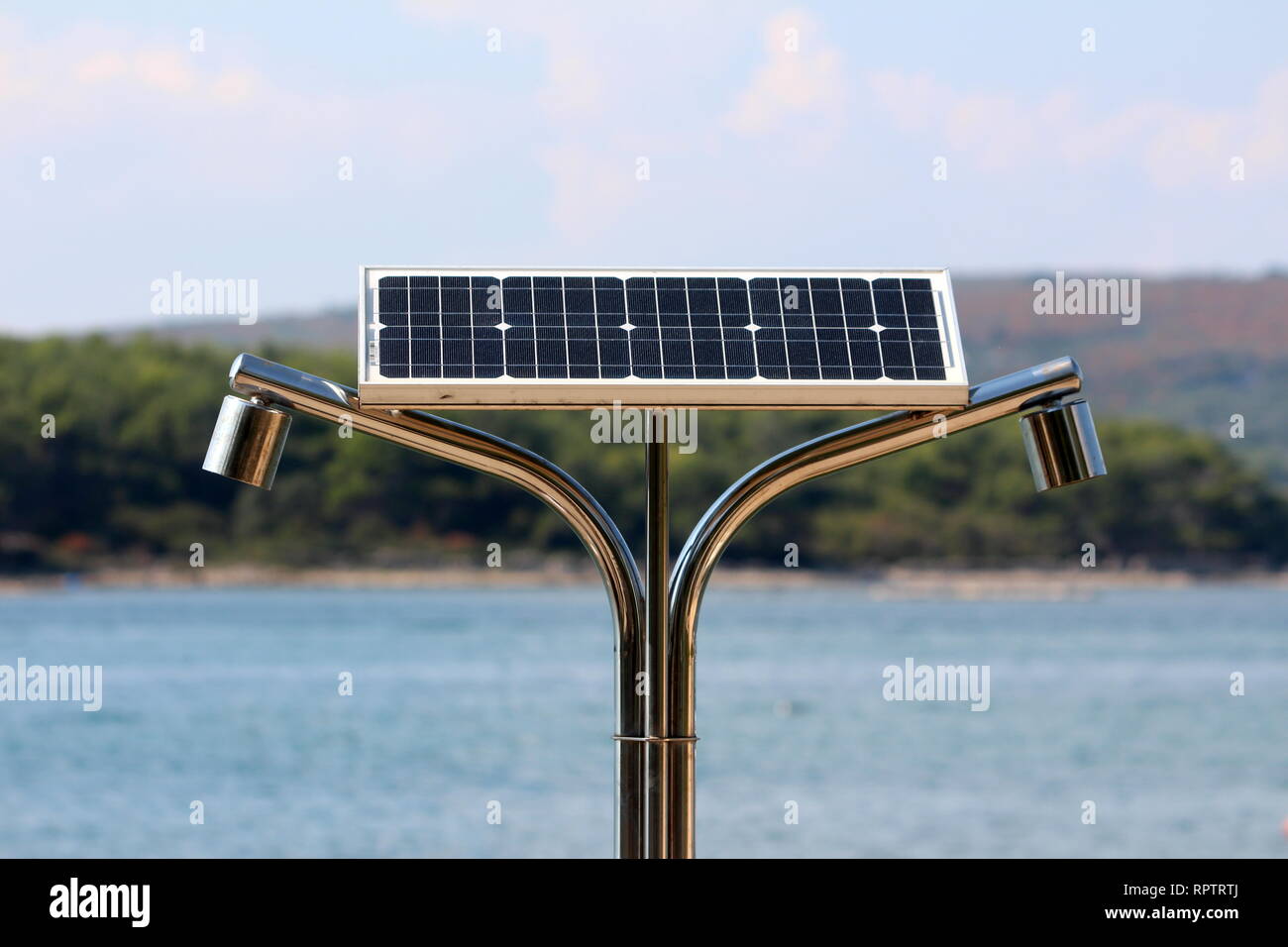 Dual public shower on sea beach powered with small solar panel on top ...