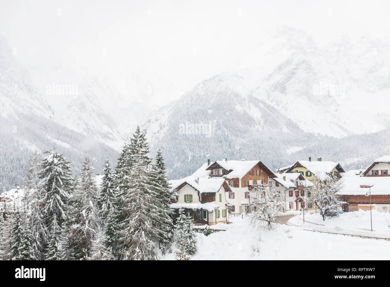 While it snows. Along the streets of the ancient village of Sappada ...