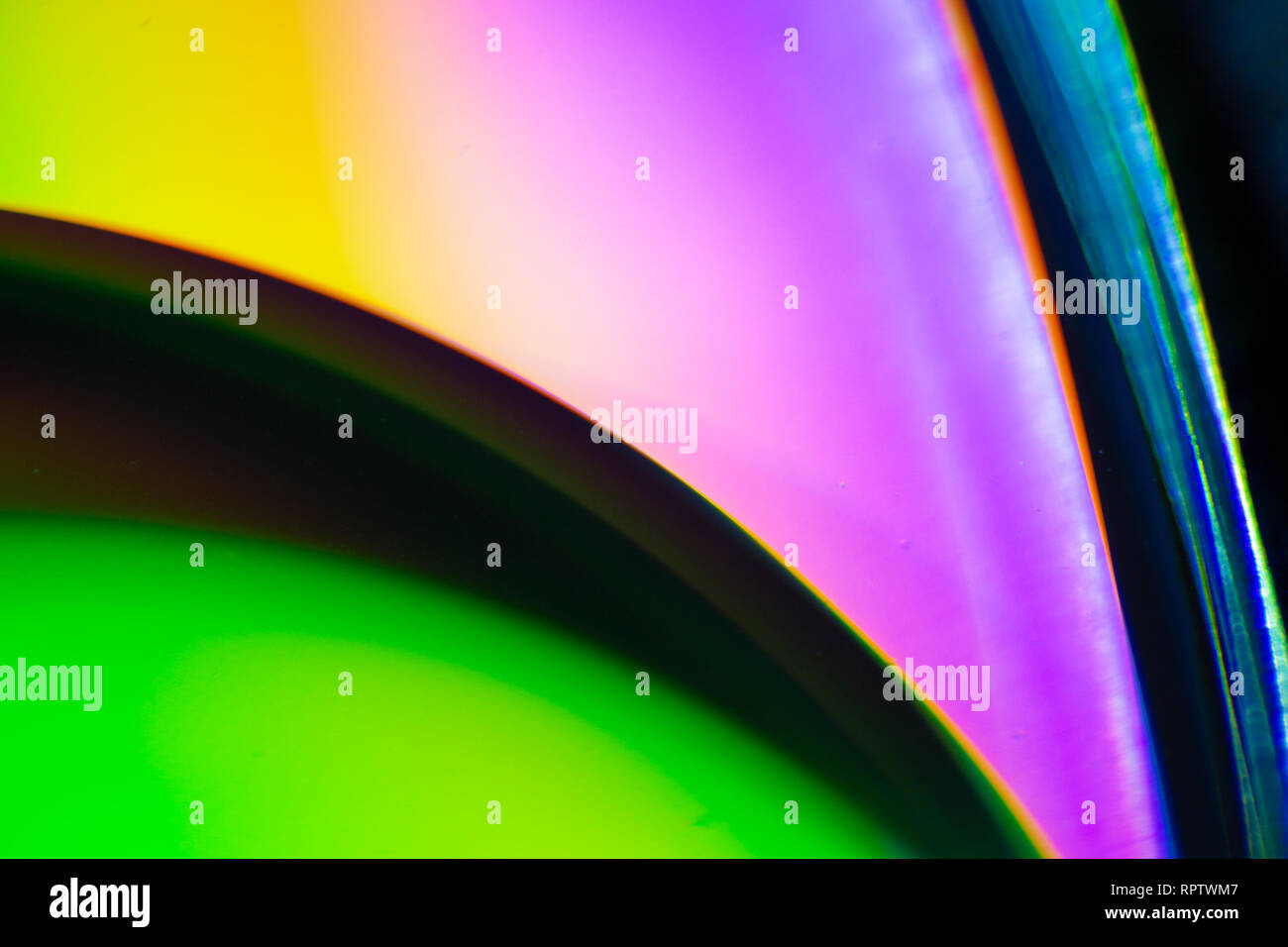 Shiny colors in part of a circle seen a disc with green, yellow pink ...