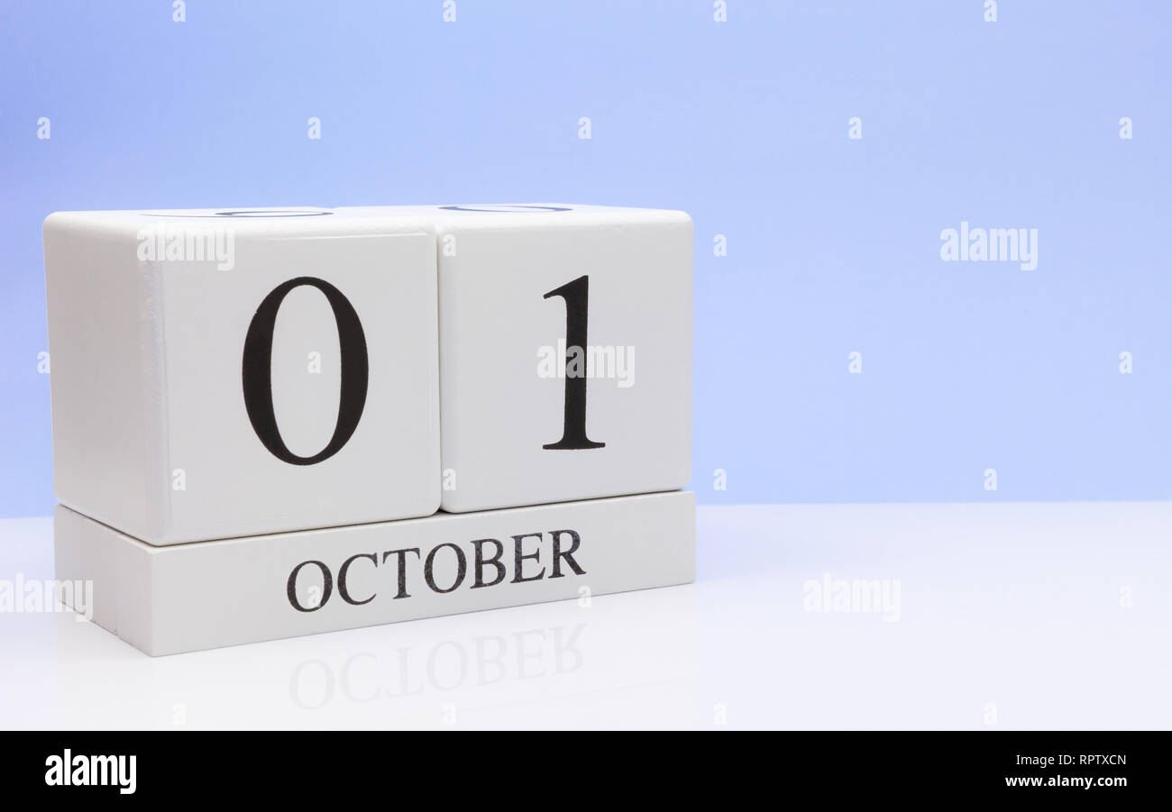 October 01st. Day 1 of month, daily calendar on white table with ...