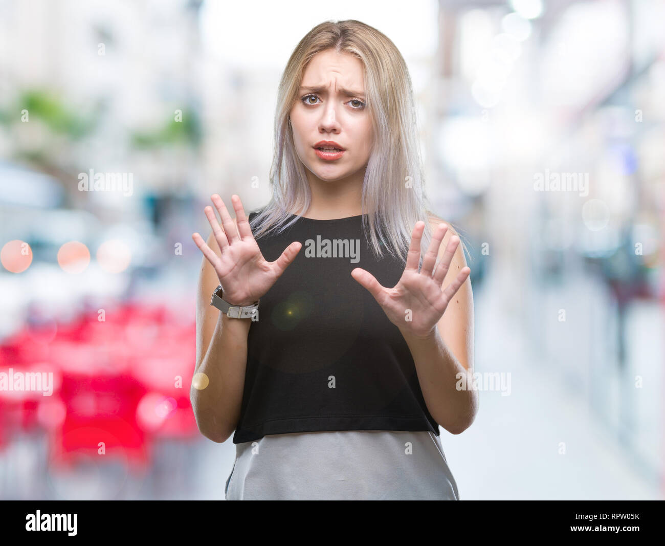 Young blonde woman over isolated background afraid and terrified with ...