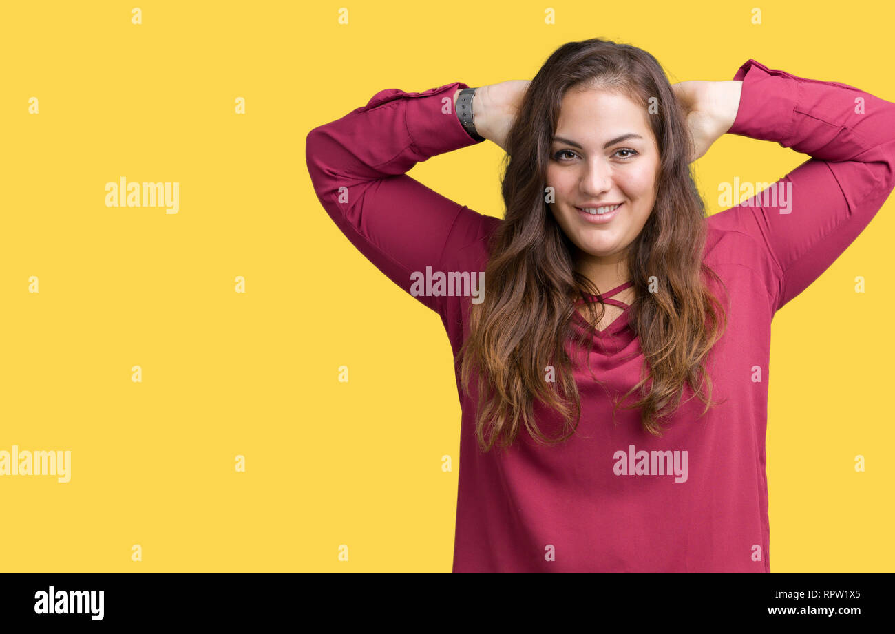 Beautiful plus size young woman over isolated background Relaxing and ...