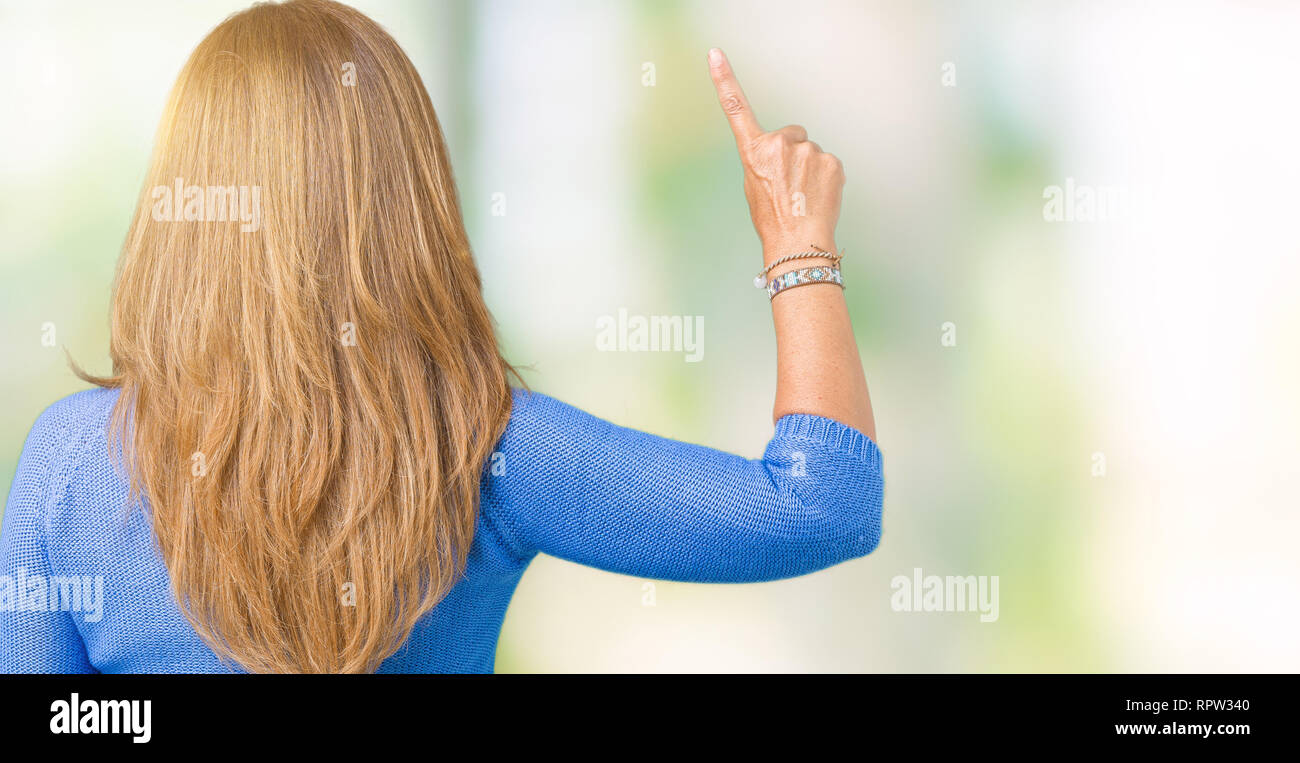 Middle age beautiful woman wearing winter sweater over isolated ...