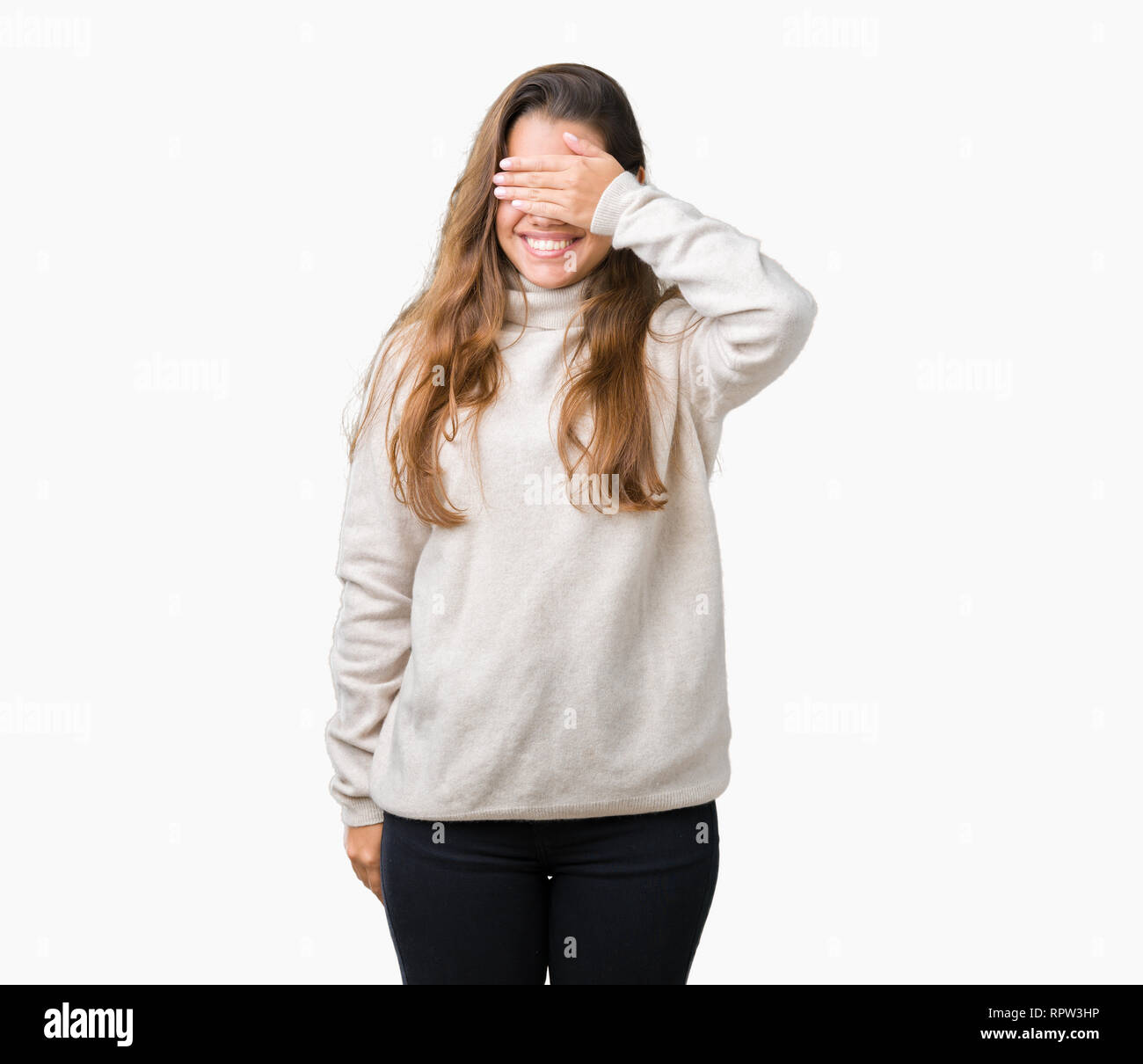 Young beautiful brunette woman wearing turtleneck sweater over isolated ...