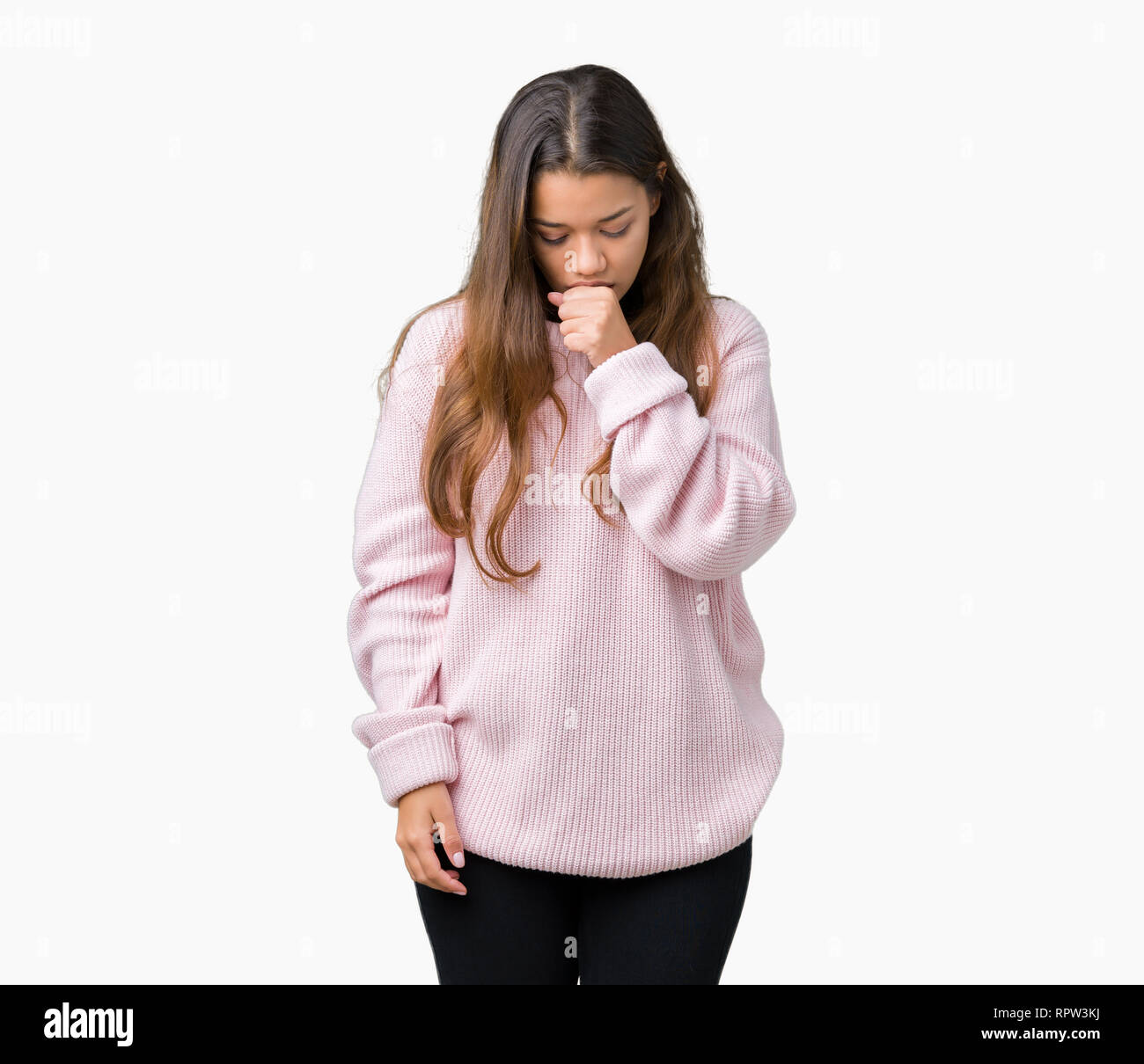 Young beautiful brunette woman wearing pink winter sweater over ...