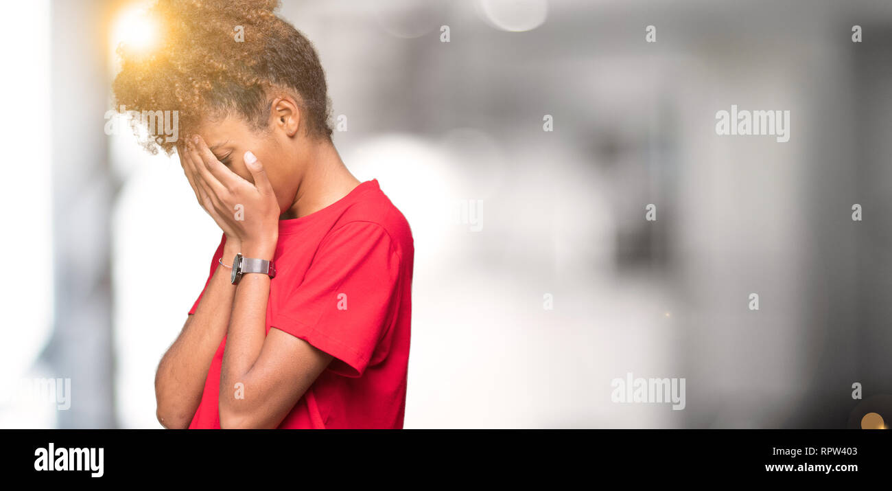 Beautiful young african american woman over isolated background with ...