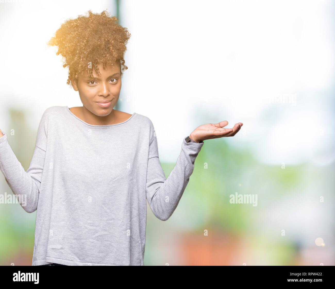 Beautiful young african american woman over isolated background ...