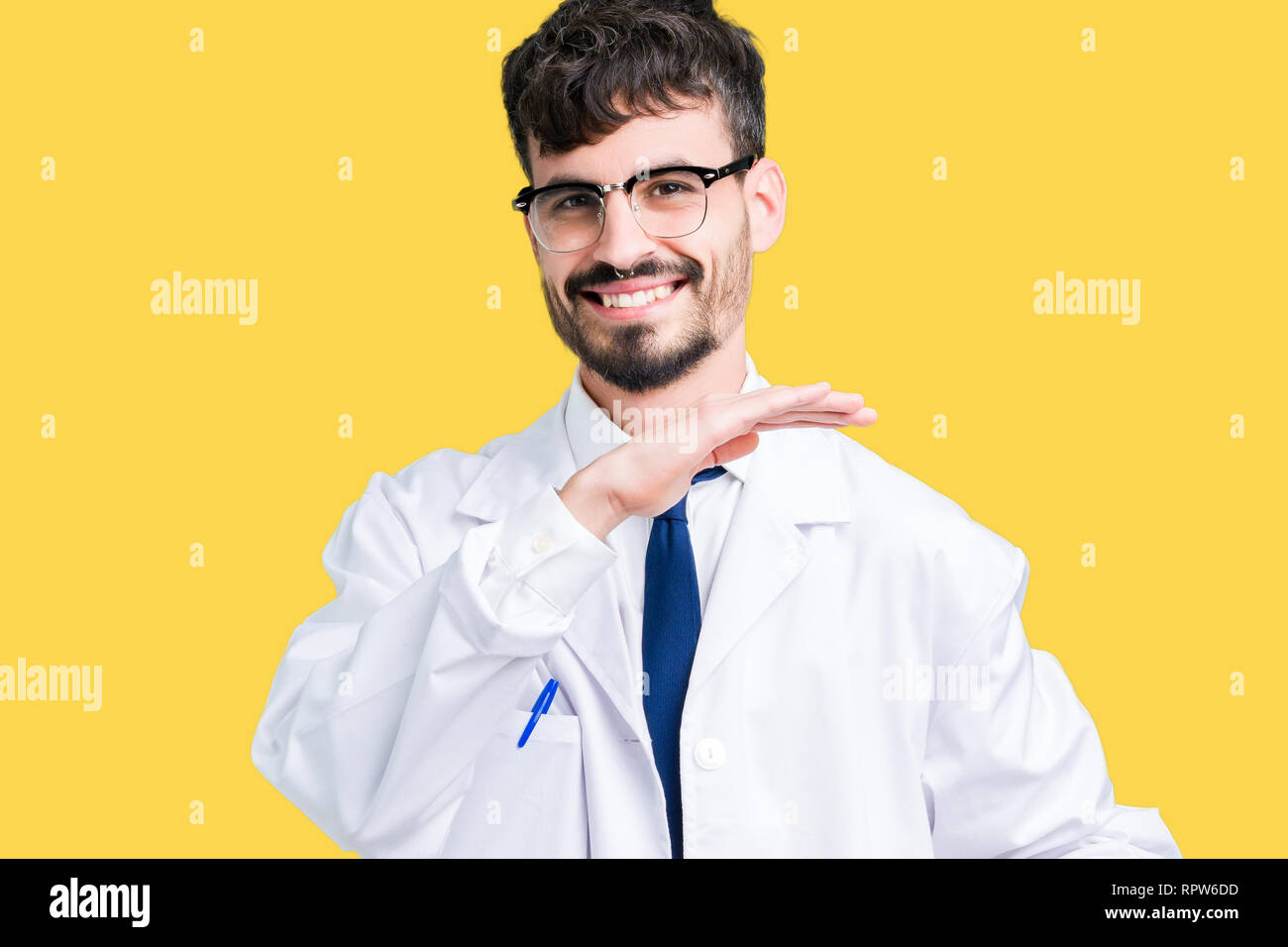 Young professional scientist man wearing white coat over isolated ...