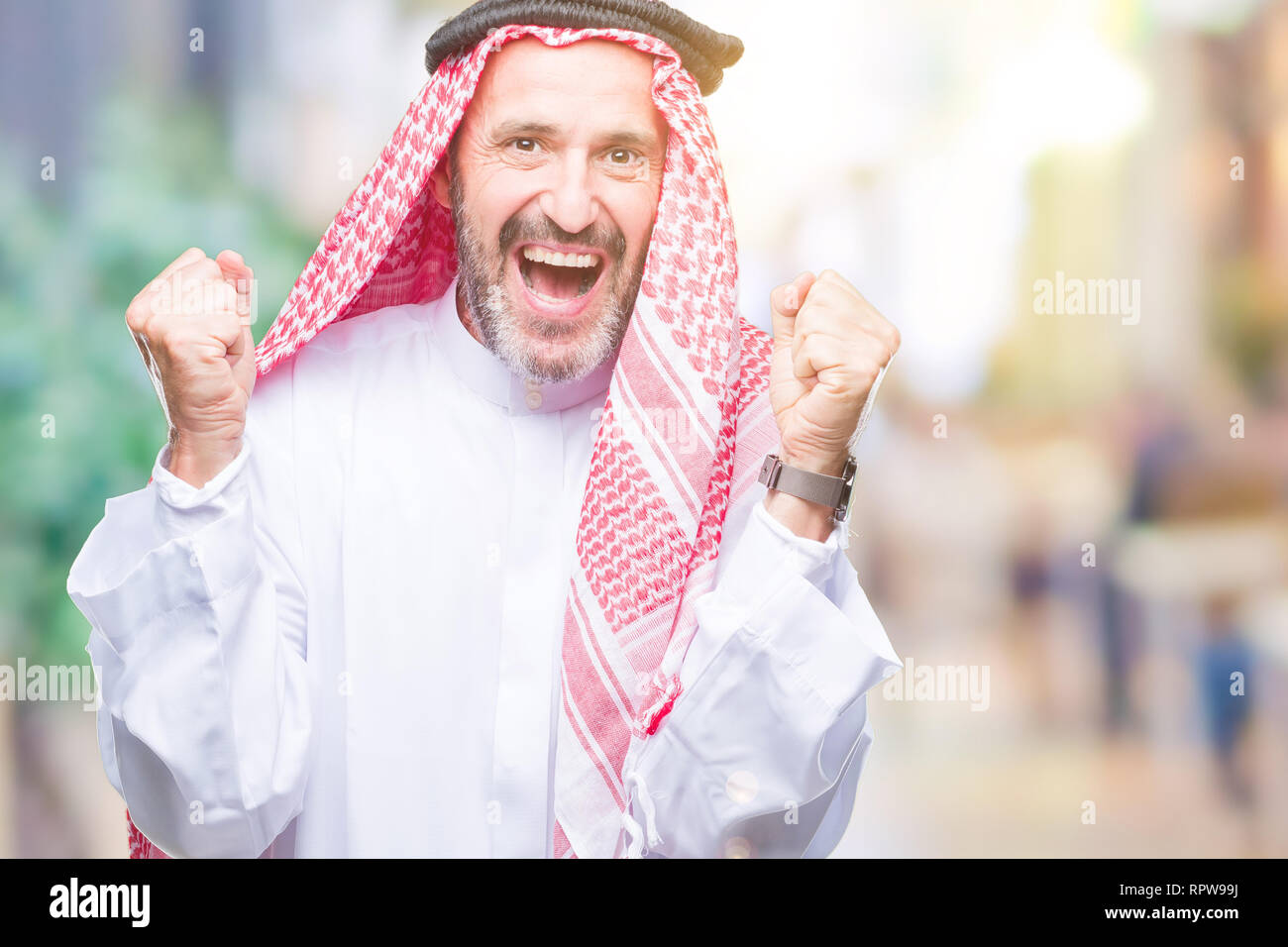 Senior arab man wearing keffiyeh over isolated background celebrating ...
