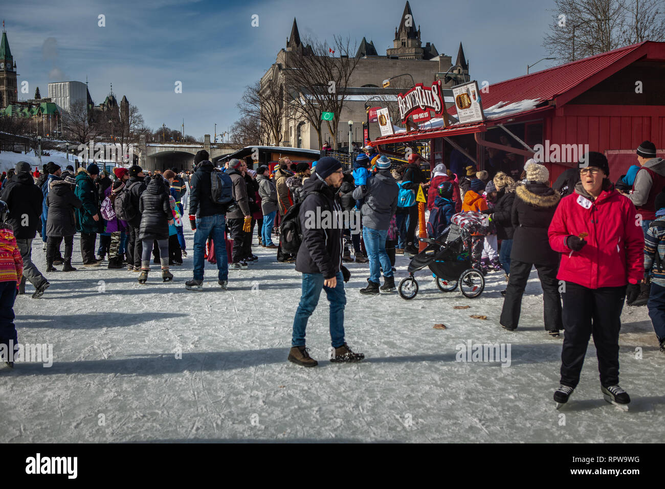People celebrate the Winterlude festival on the frozen Rideau Canal ...