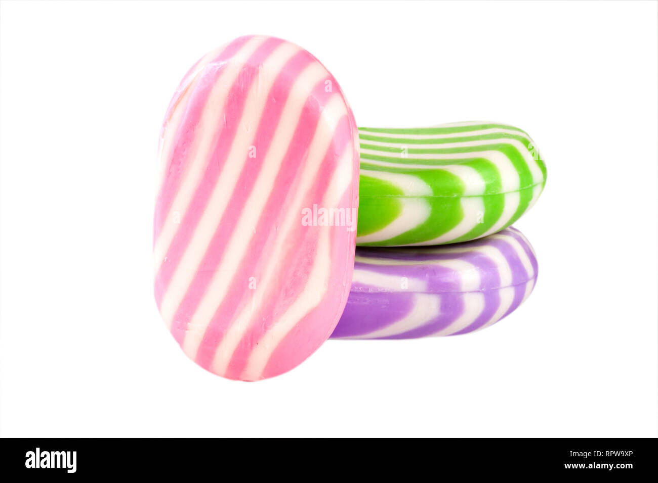 Three multi-colored striped soaps isolated on white background Stock ...