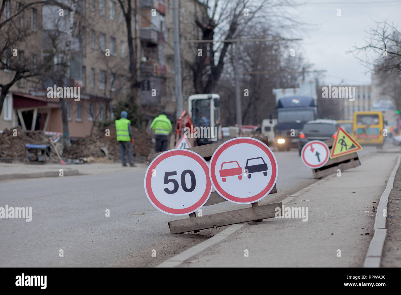 Road signs, detour, road repair on street background, truck and ...