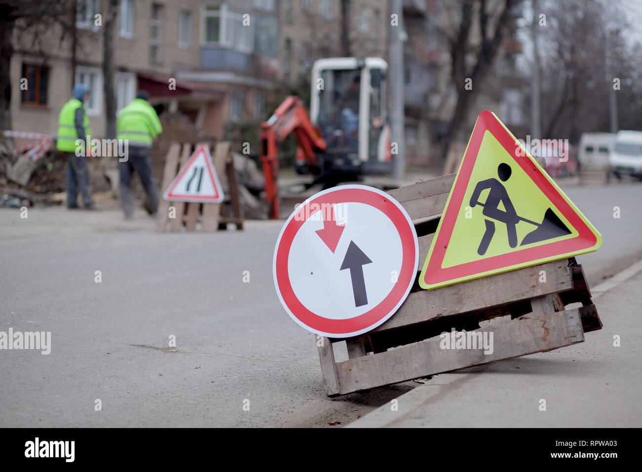 Road signs, detour, road repair on street background, truck and ...