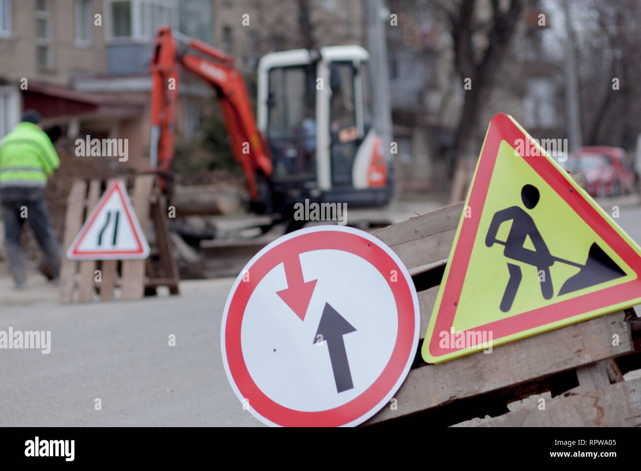 Road signs, detour, road repair on street background, truck and ...