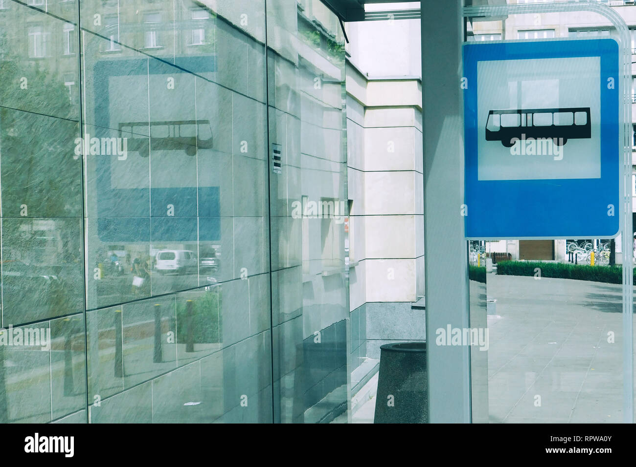 Photo of a bus stop sign on a concrete pillar in the city Stock Photo ...