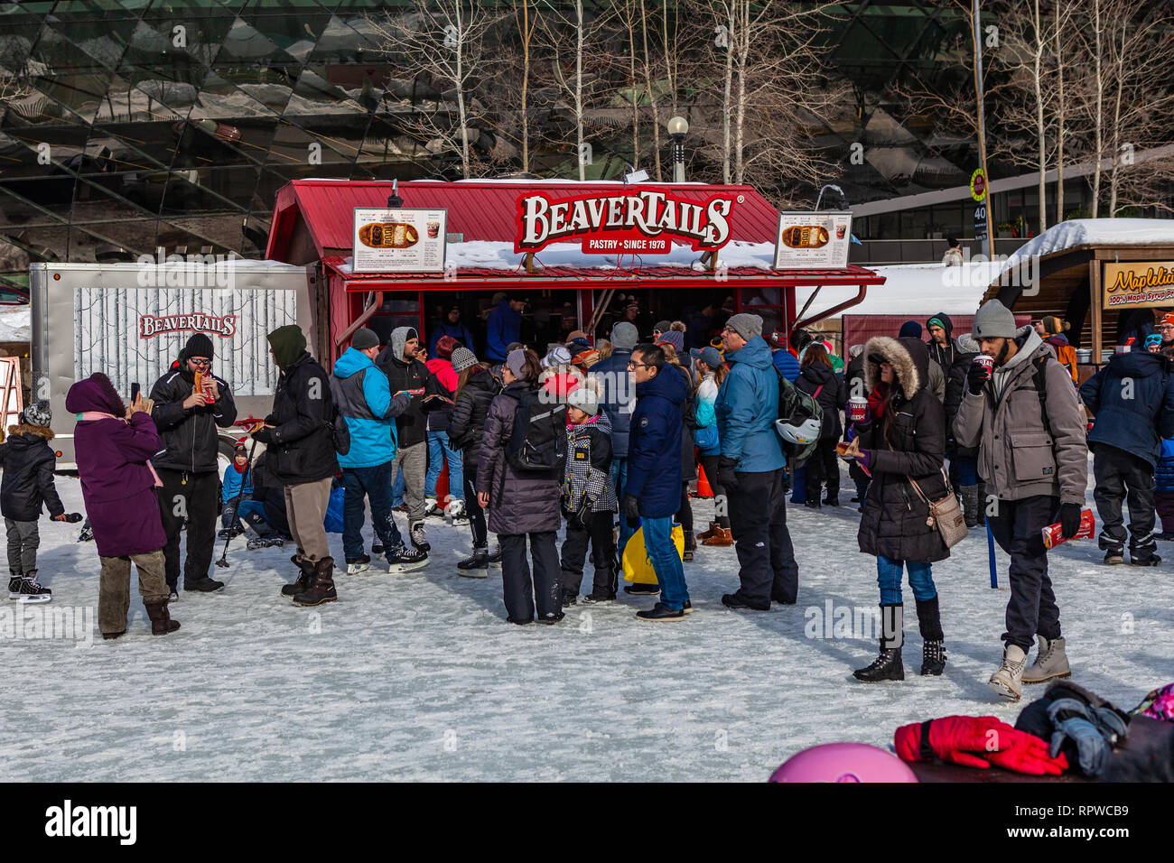 People celebrate the Winterlude festival on the frozen Rideau Canal ...