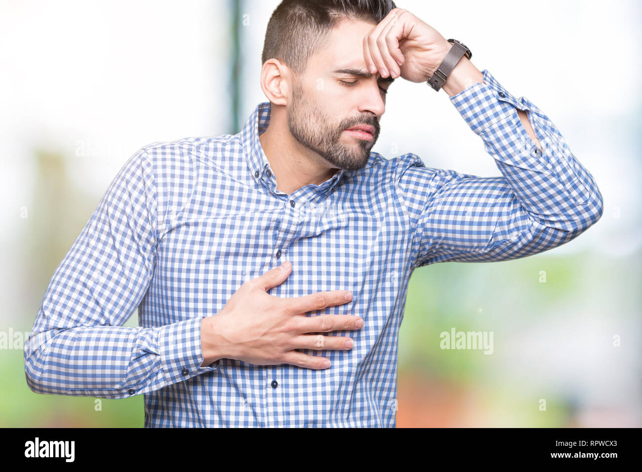 Young handsome man over isolated background Touching forehead for ...