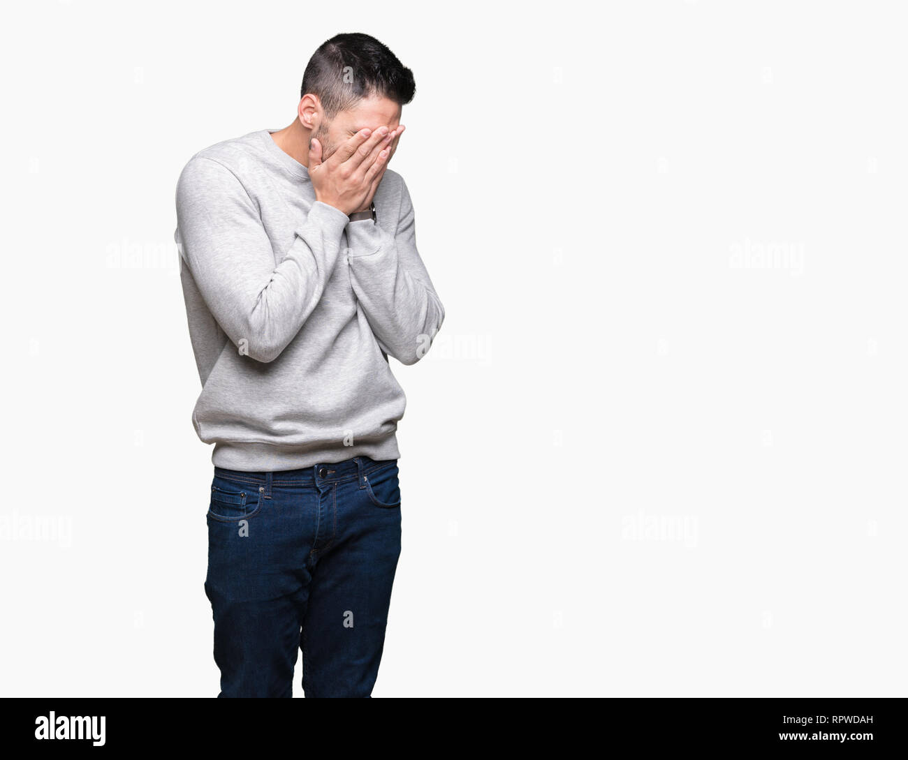 Young handsome man wearing sweatshirt over isolated background with sad ...