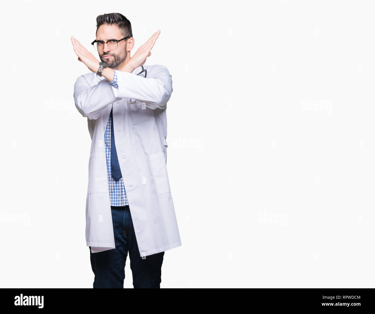 Handsome young doctor man over isolated background Rejection expression ...