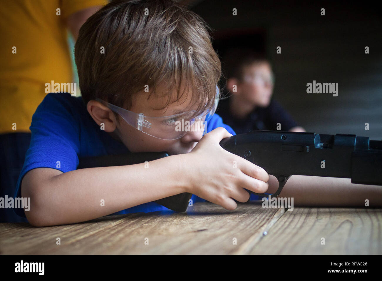 Boy with rifle hi-res stock photography and images - Alamy