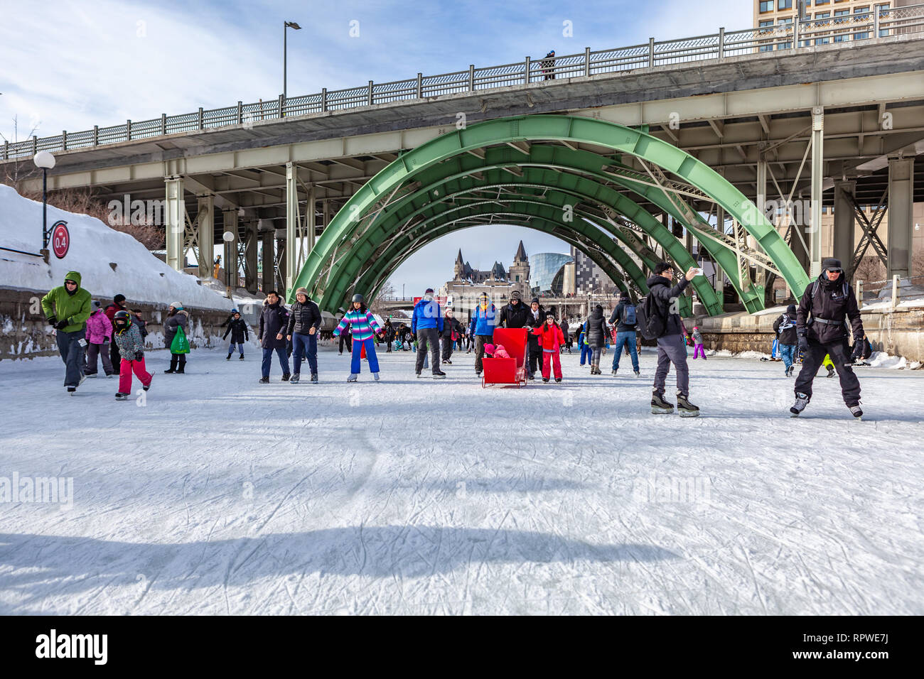People celebrate the Winterlude festival on the frozen Rideau Canal ...