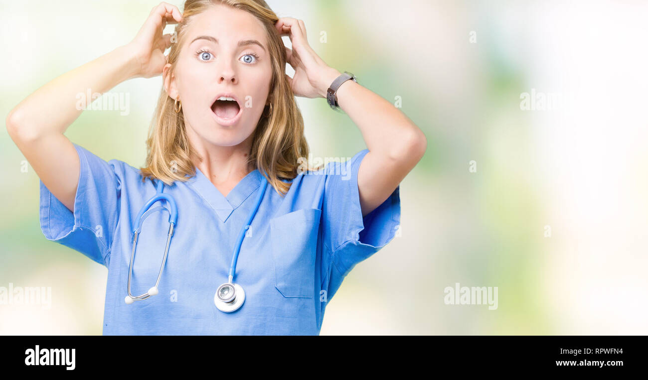 Beautiful young doctor woman wearing medical uniform over isolated ...