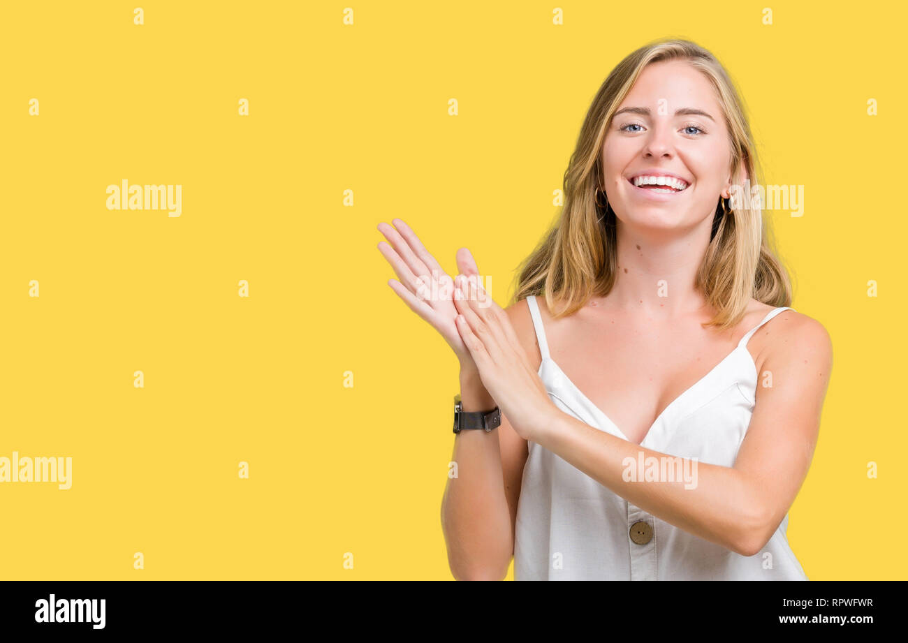 Beautiful young woman over isolated background Clapping and applauding ...