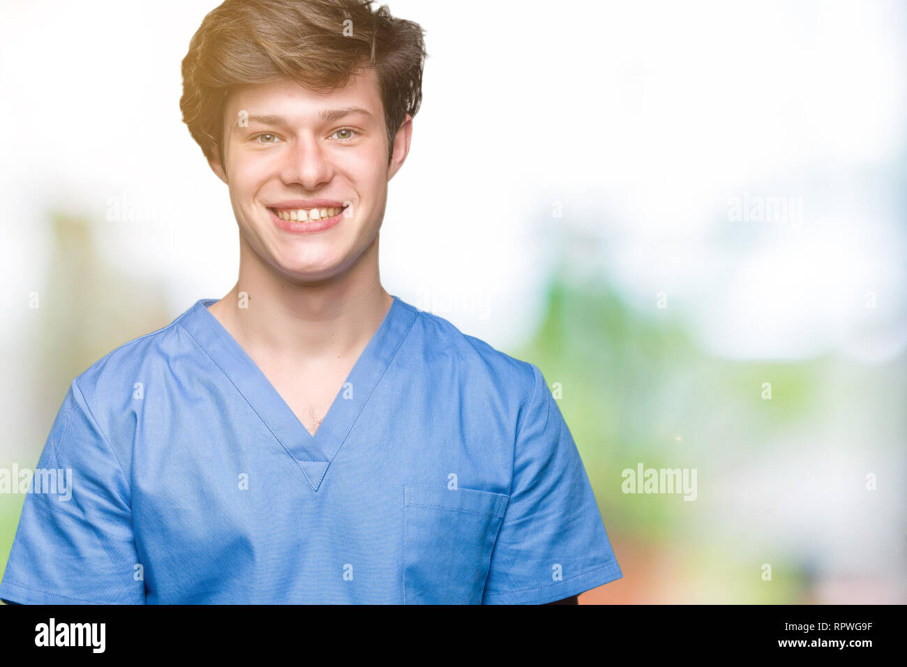 Young doctor wearing medical uniform over isolated background with a ...