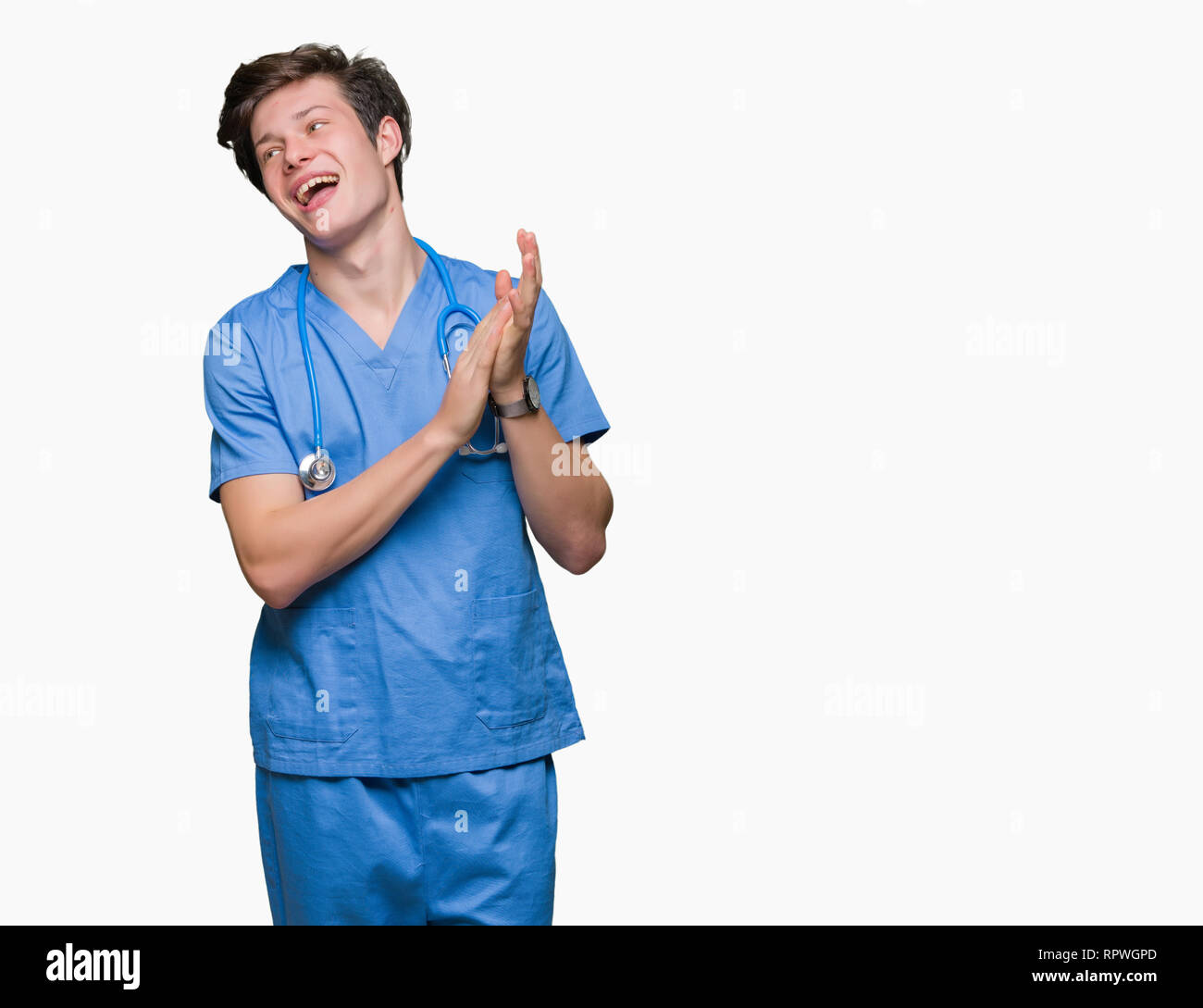 Young doctor wearing medical uniform over isolated background Clapping ...